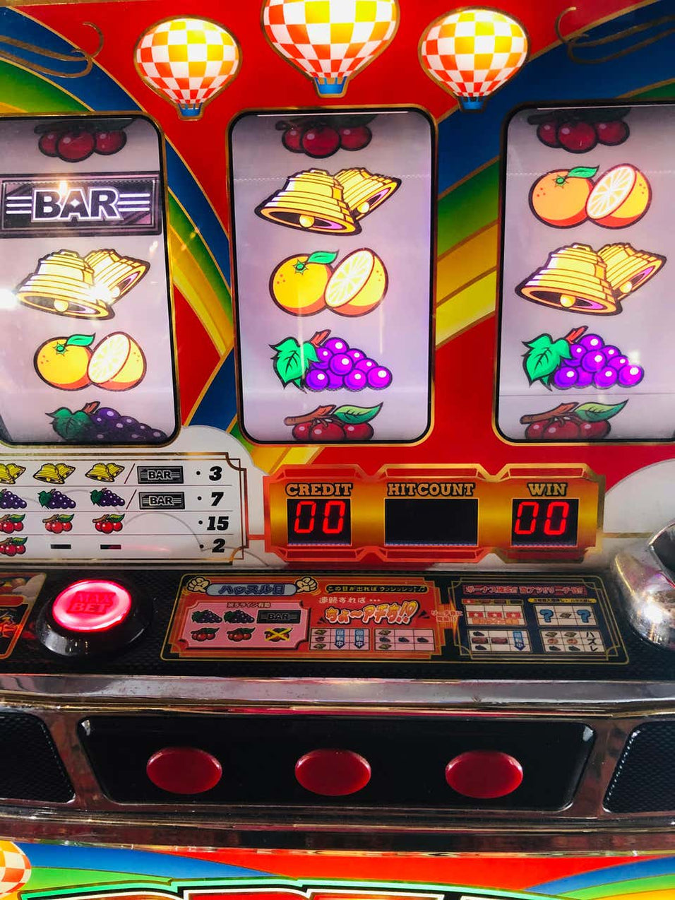 Vintage Japanese Slot Machine with Tokens
